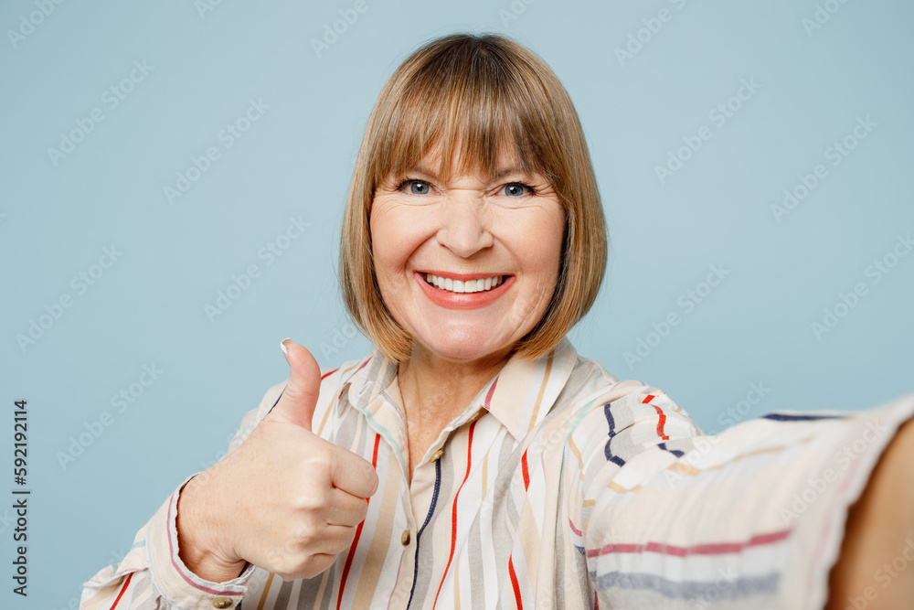 Close up happy fun elderly woman 50s years old wearing light striped ...