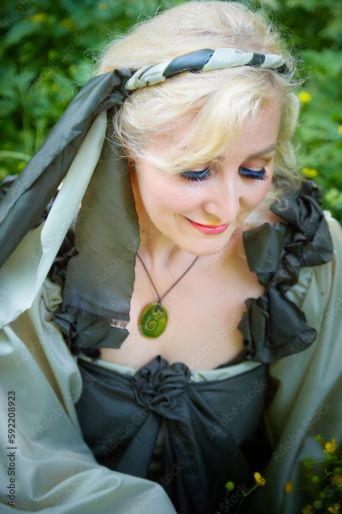 Adult mature woman 40-60 in a green long fairy dress in forest. Photo ... Adult mature woman 40-60 in a green long fairy dress in forest. Photo ...