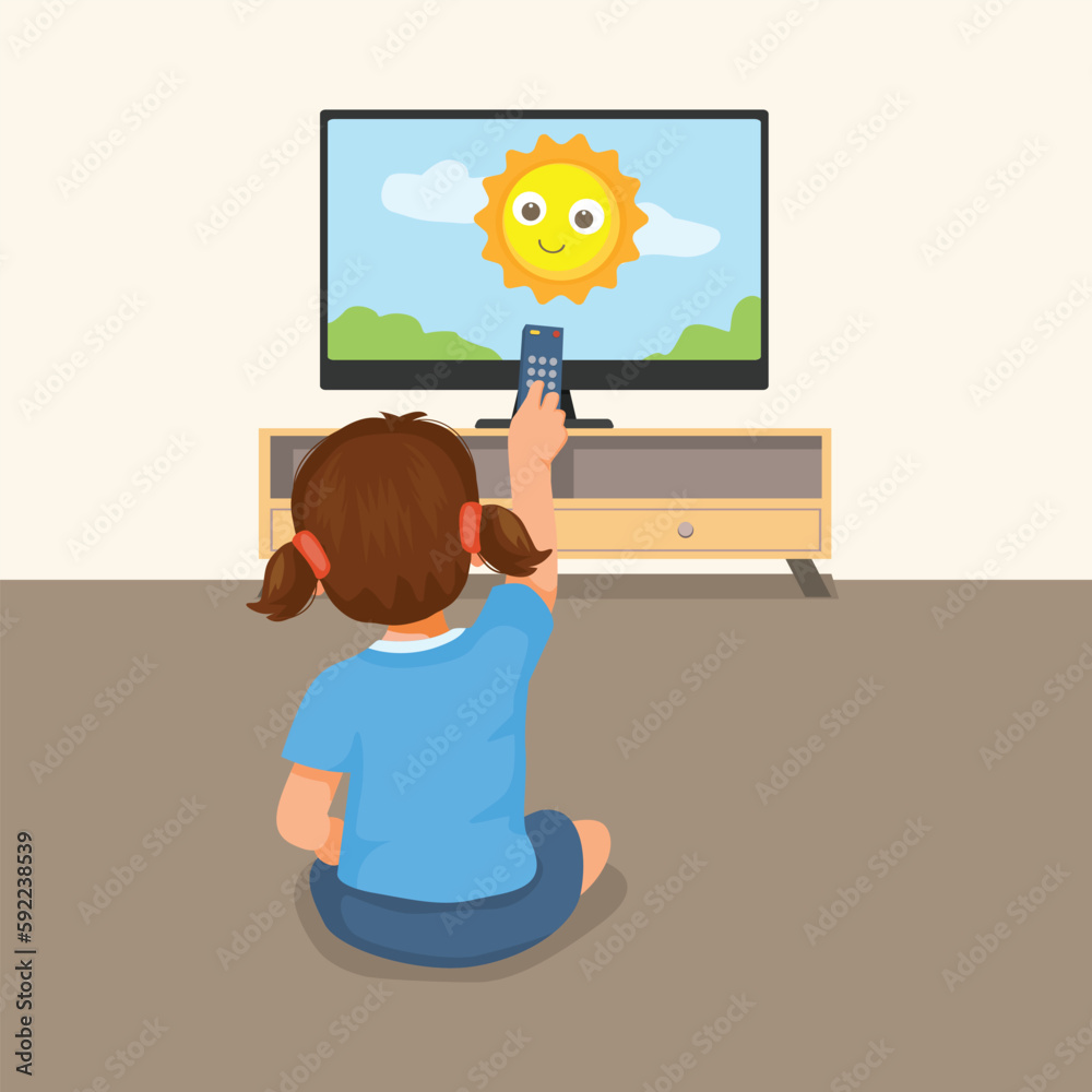 Cute little girl watching TV holding remote control sitting on the ...
