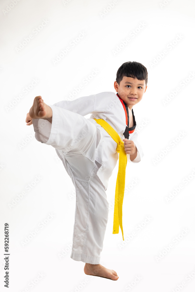 Kick. kids karate martial arts. Taekwondo uniform with yellow belt ...