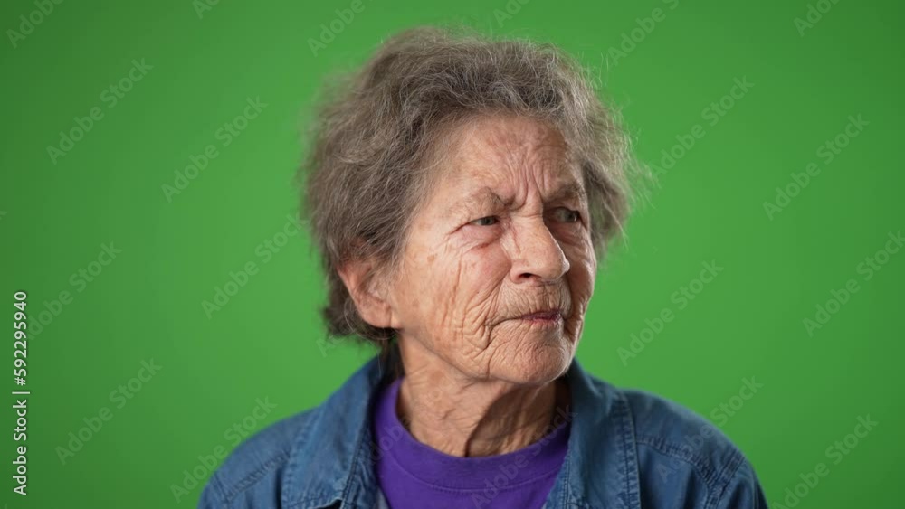 Slow motion closeup portrait of angry upset frustrated angry elderly ...