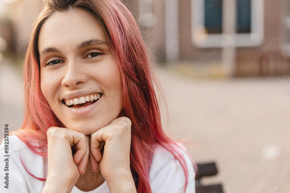 Photo of good looking pretty female hold hands chin adore admire ...