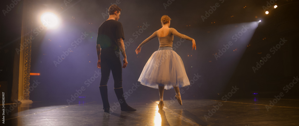 Full shot of ballet dancers practicing ballet movements and rehearse ...