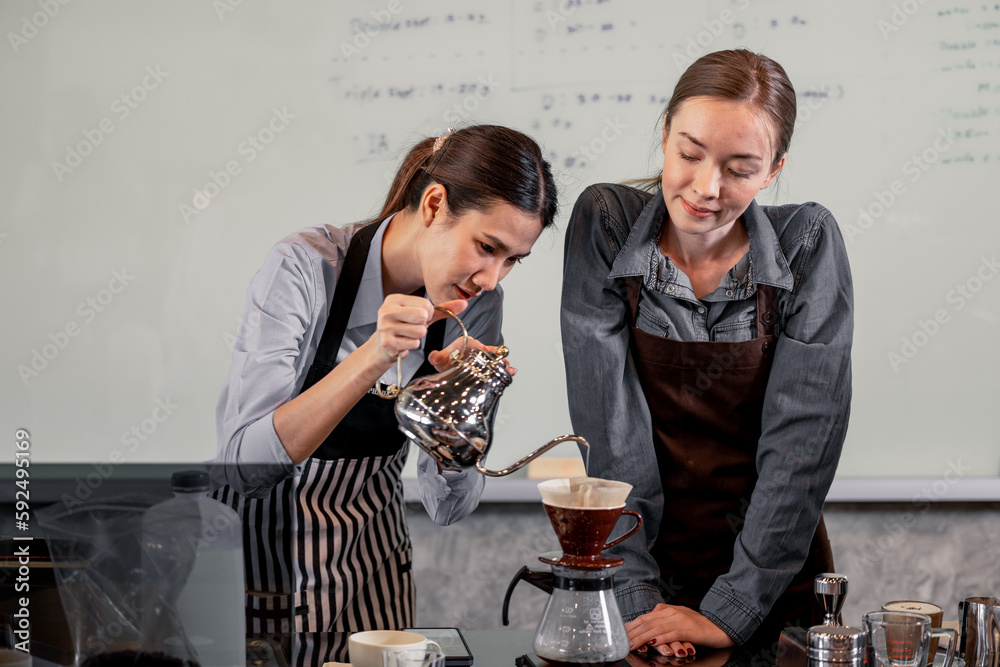 Young adult baristas follow recipes to create artisan and specialty ...