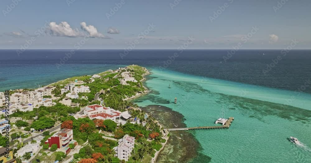 Isla Mujeres Mexico Aerial v2 cinematic flyover seaside resorts towards ...