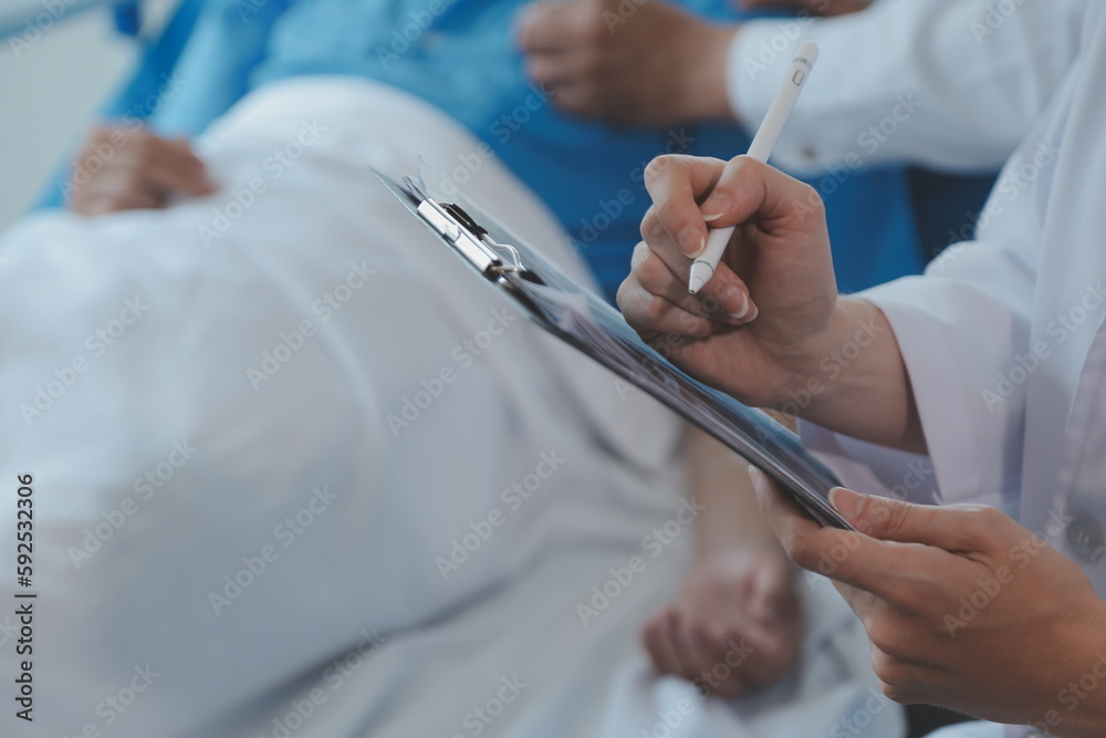 Injured patient showing doctor broken wrist and arm with bandage in ...