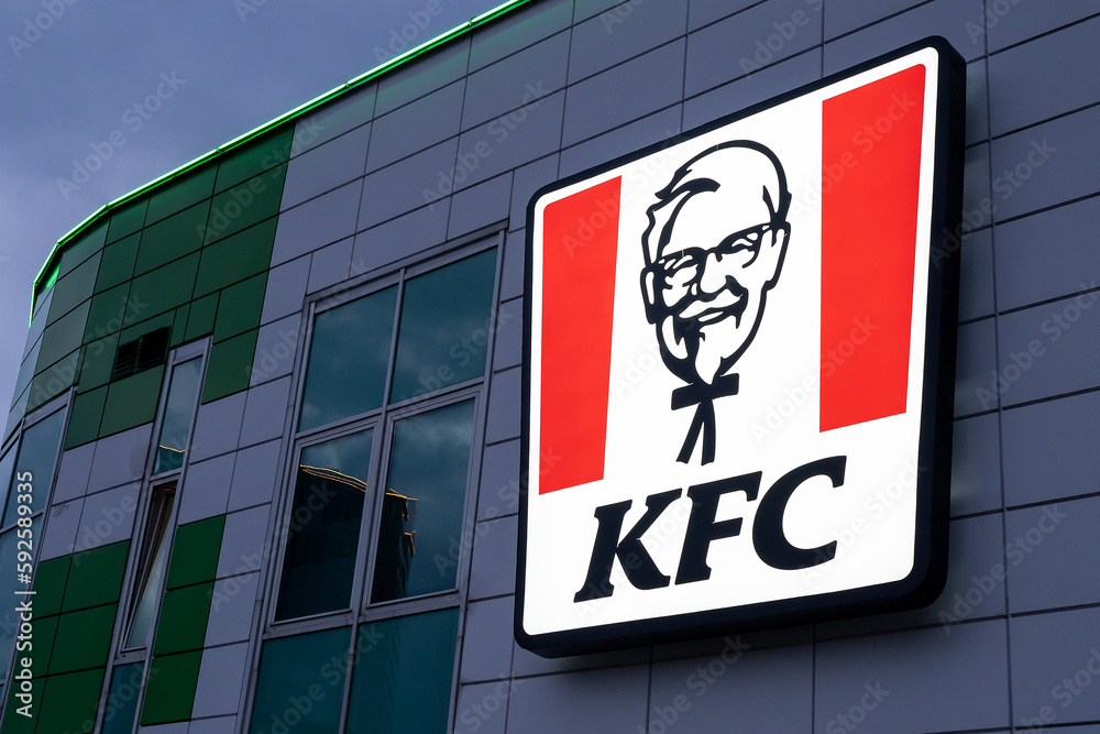 KFC neon sign logo on a facade. KFC is a fast food restaurant chain ...