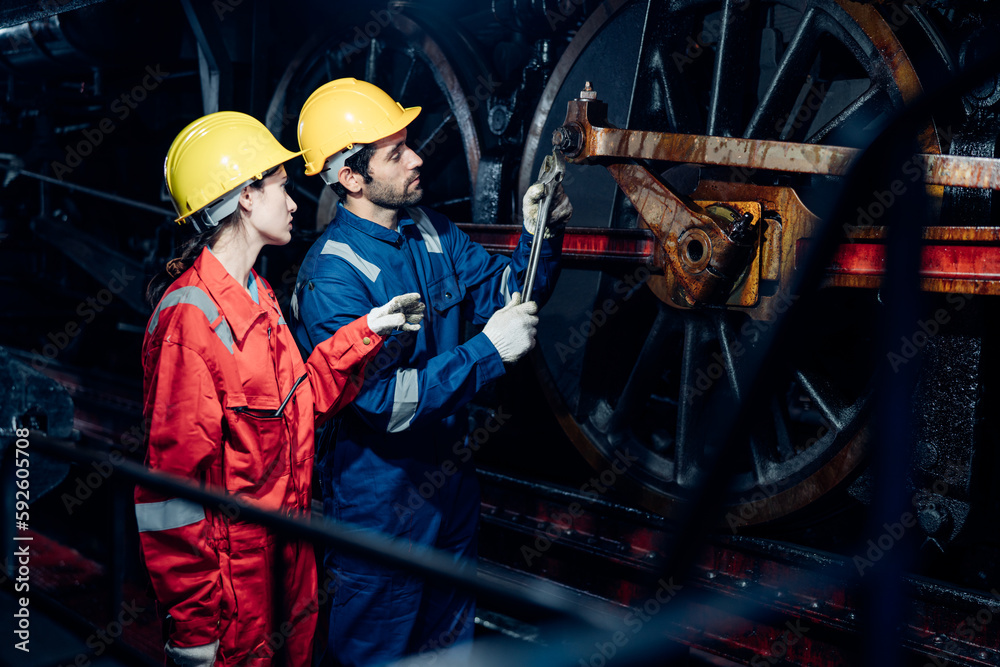 Team of engineer railway wearing safety uniform and helmet under ...