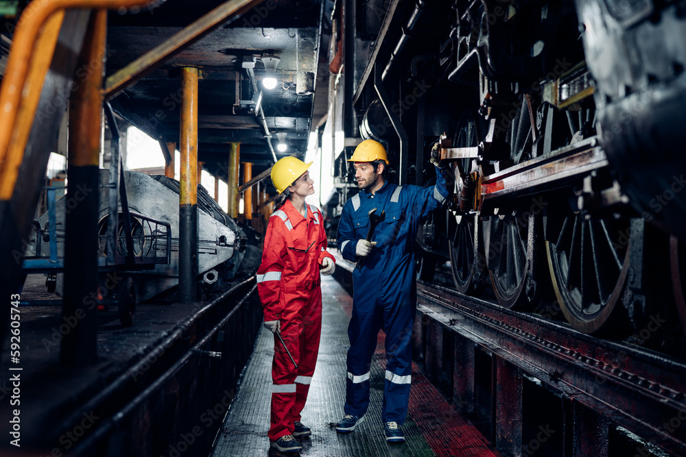 Team of engineer railway wearing safety uniform and helmet under ...