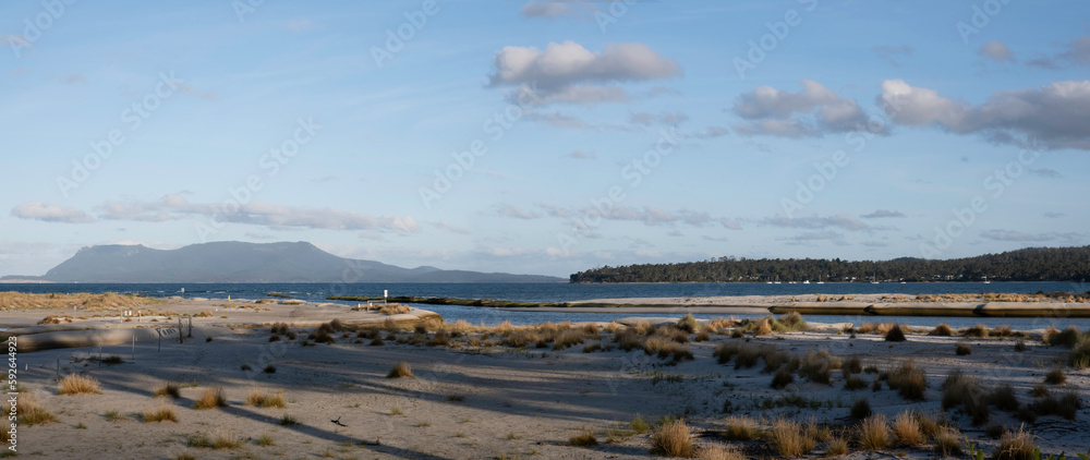 Orford River mouth on Orford's iconic Raspins Beach with mountains on ...