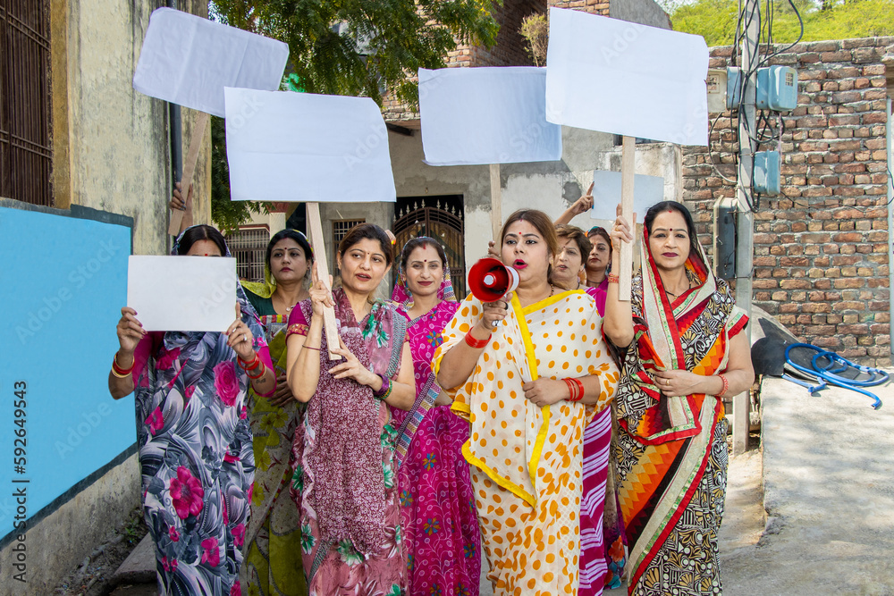 Group of traditional indian woman holding blank cardboard placard ...