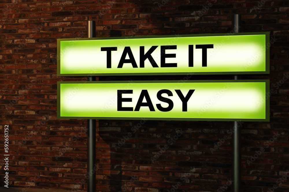Take it easy. Black letters on a light box. Illuminated sign in front ...