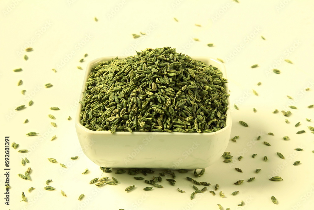 dried green fennel seeds or Saunf herb in bowl also known as variyali ...