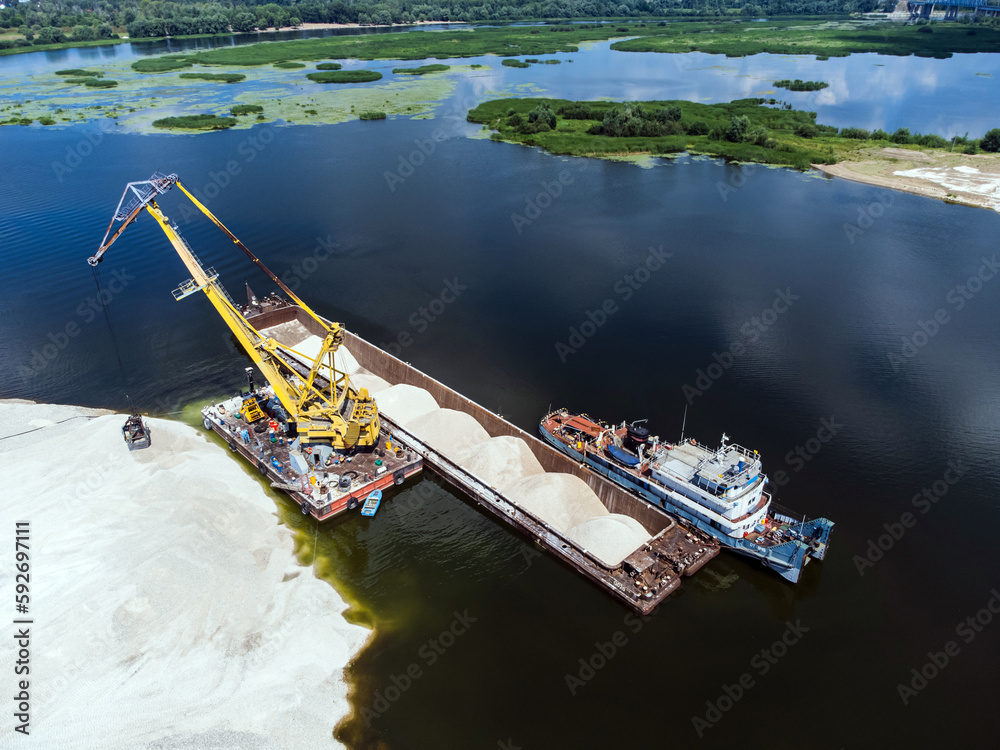 Aerial view of the loading of dry cargo ships with crushed stone. Stock ...