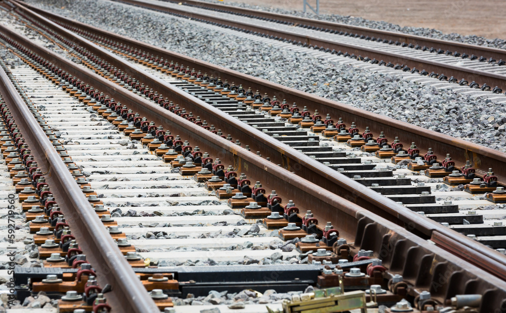 Railroad tracks on railway station Stock Photo | Adobe Stock