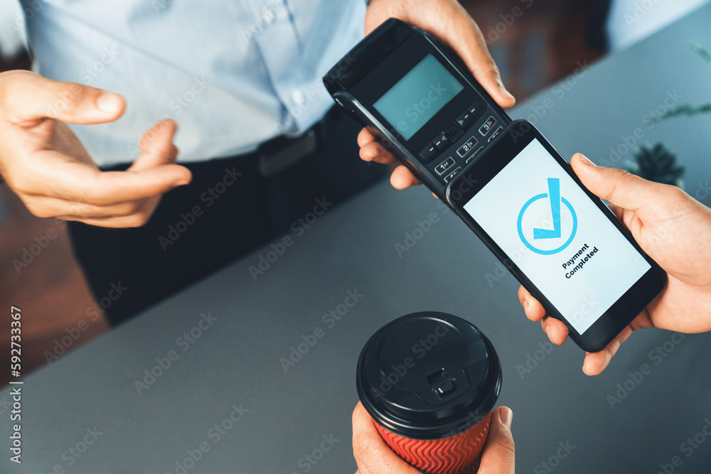 Foto de Hand holding smartphone with NFC QR code device, scanning ...