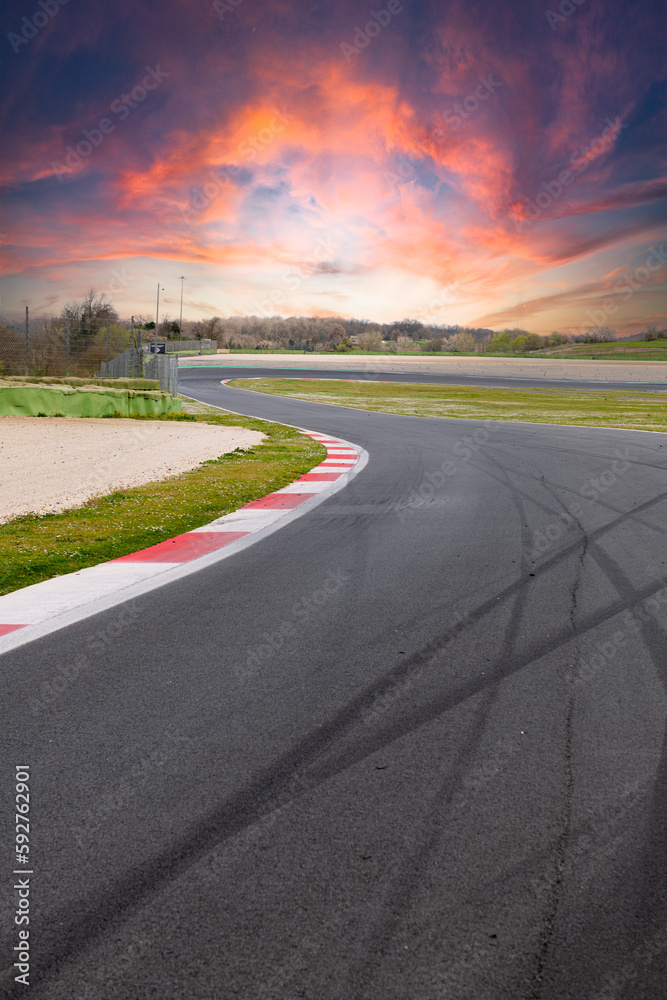 Foto de Motor sport asphalt race track and curbs with skid marks, low ...