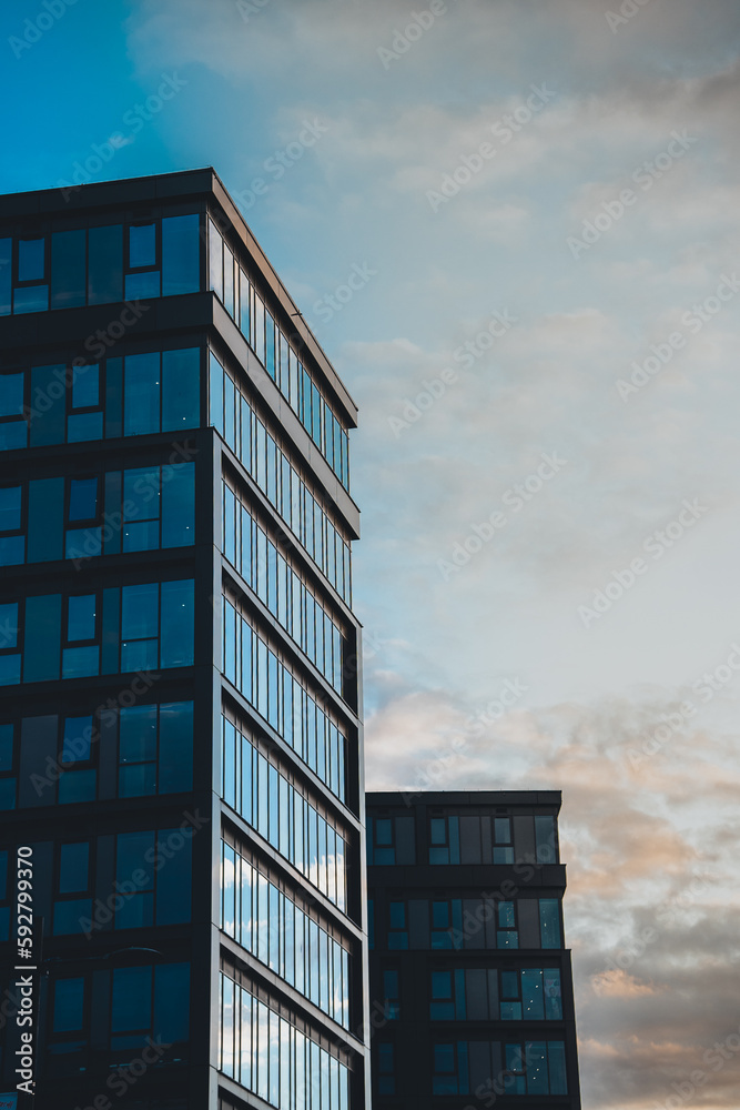 Tower block office building windows reflective glass blue sky tall ...