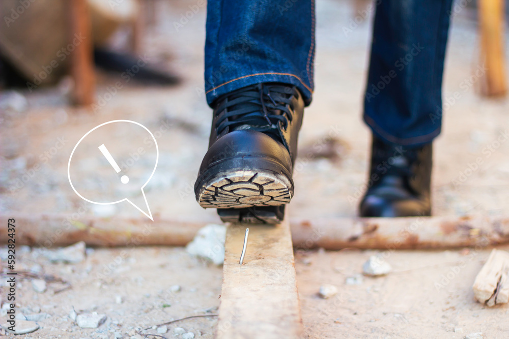 Wear safety shoes to ensure safety at work. construction workers wear ...