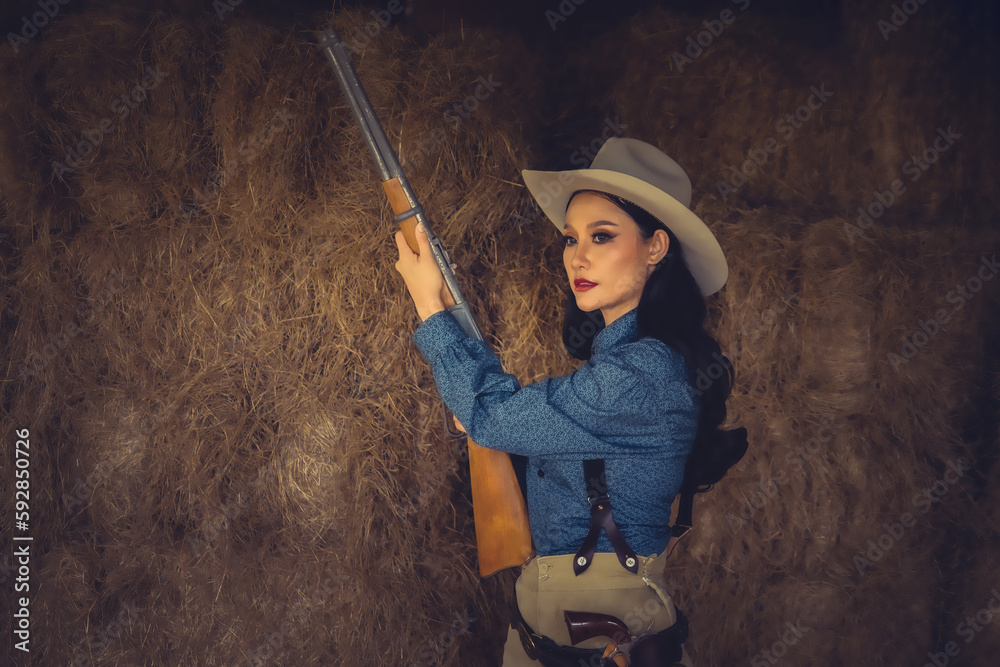 Cowgirl.cowgirl with gun prepares to gun fight.Beautiful girl in a ...
