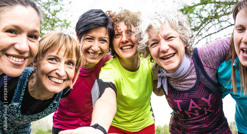 Happy multi generational women having fun together at city park ...