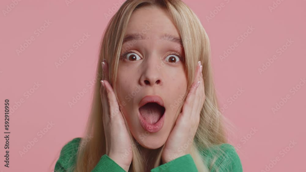 Oh my God, Wow. Excited amazed winner woman surprise looking at camera ...