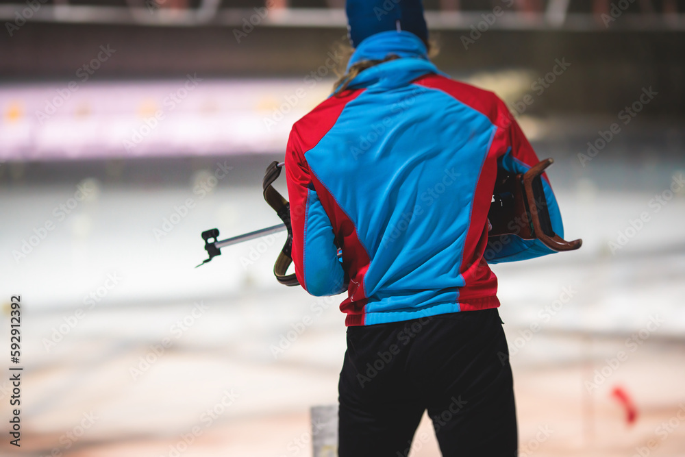 Biathlete with rifle on a shooting range during biathlon training ...