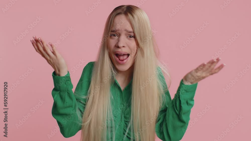 What. Why. Sincere irritated caucasian woman raising hands in indignant ...