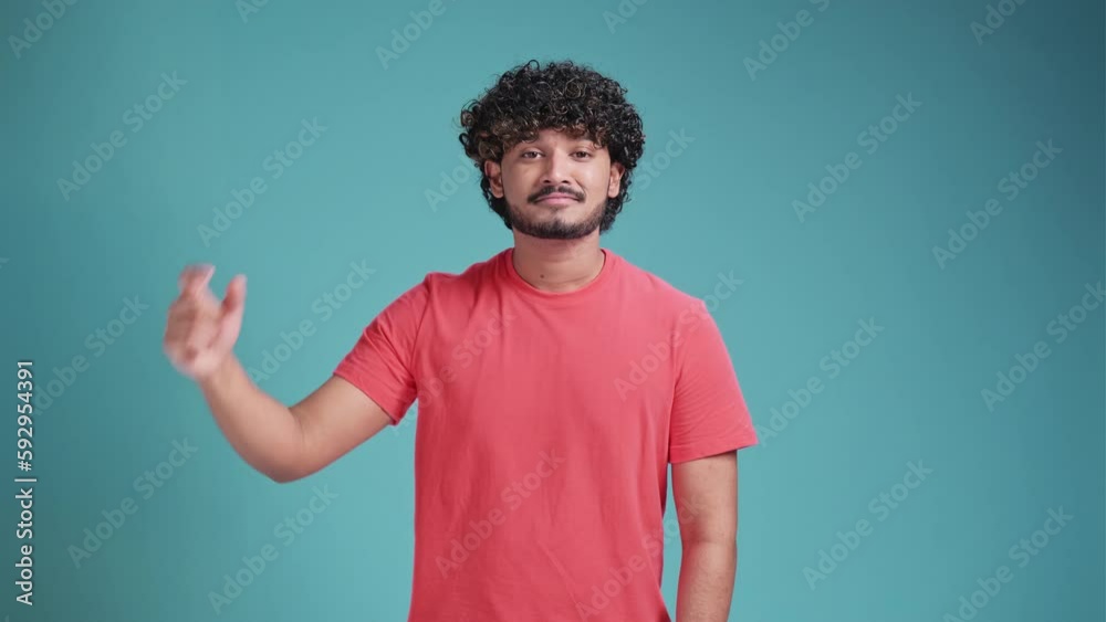 Disappointed millennial Indian man in glasses showing small size length ...