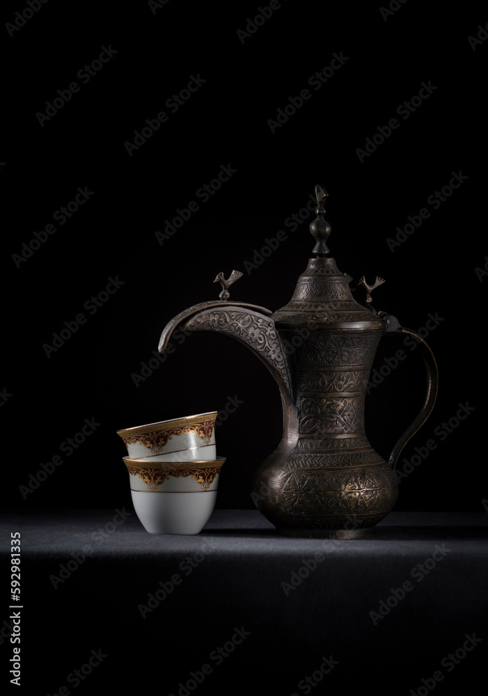Traditional Arabic coffee cups and coffee pot. Arabic coffee cups with ...