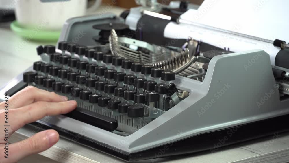 Writing a book and typing old typewriter, top view. Man typing on old ...