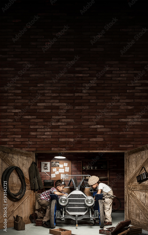 Young mechanics in the garage with a retro car. Banner with a place for ...