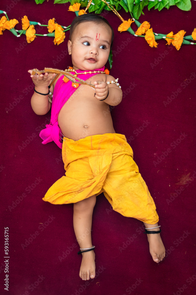 cute Indian boy dresses as lord rama with bow and flowers from top ...