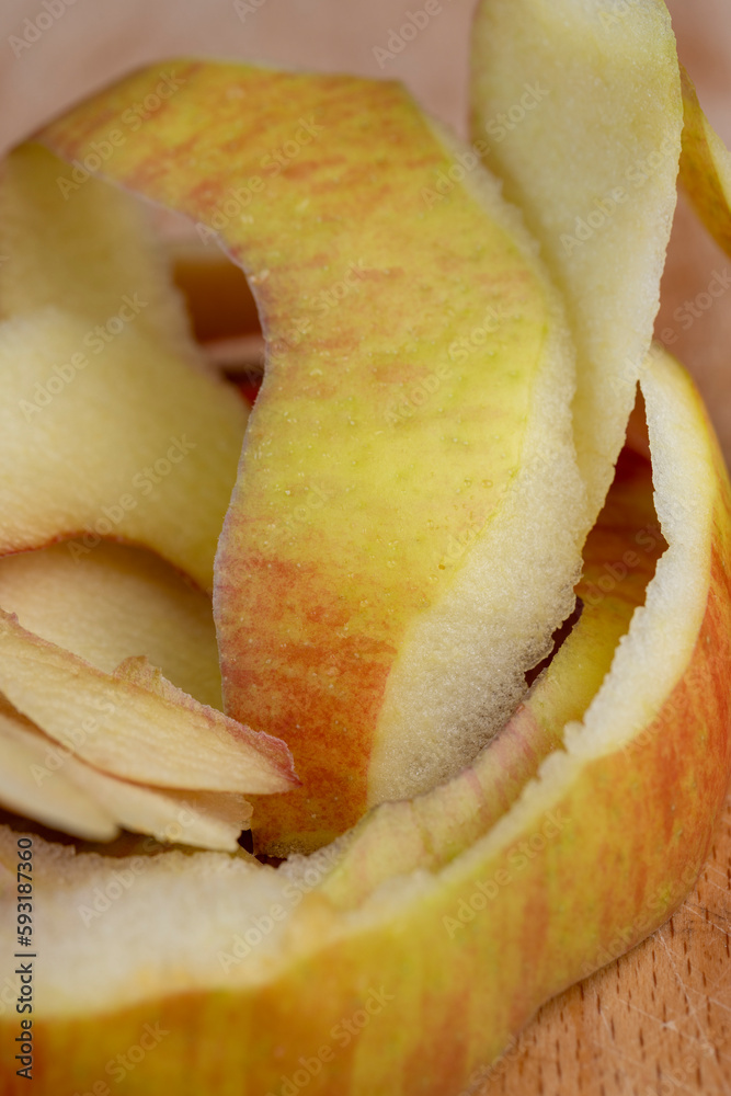 the peel of a peeled apple scattered on the board Stock Photo | Adobe Stock