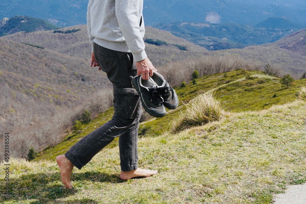 Bare feet in the green grass. Health benefits. Concept of earthing ...