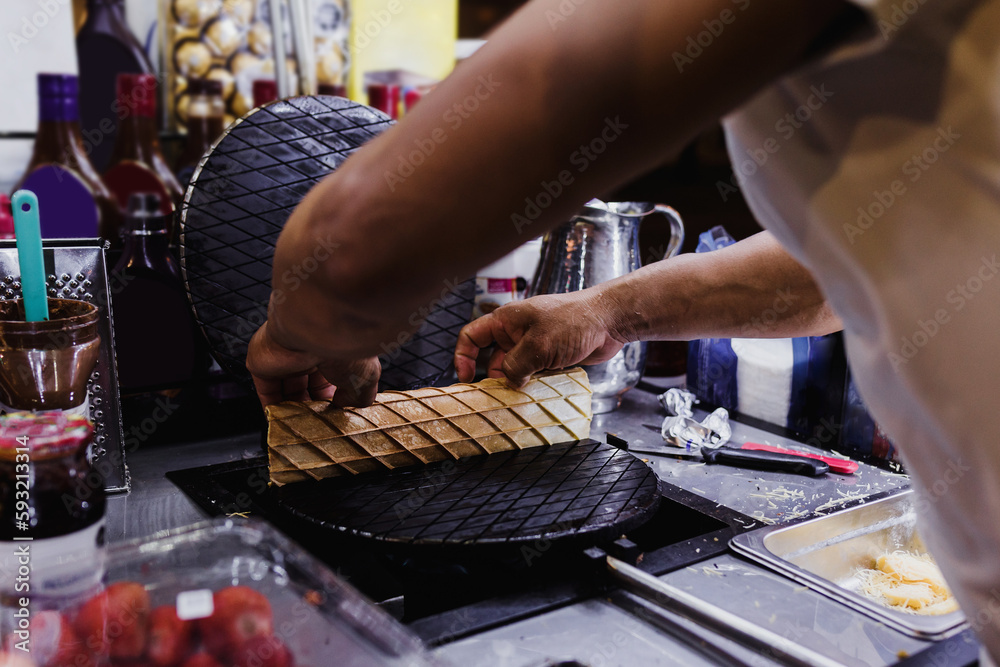 preparing Marquesitas mexican dessert traditional in Yucatan and Cancun ...