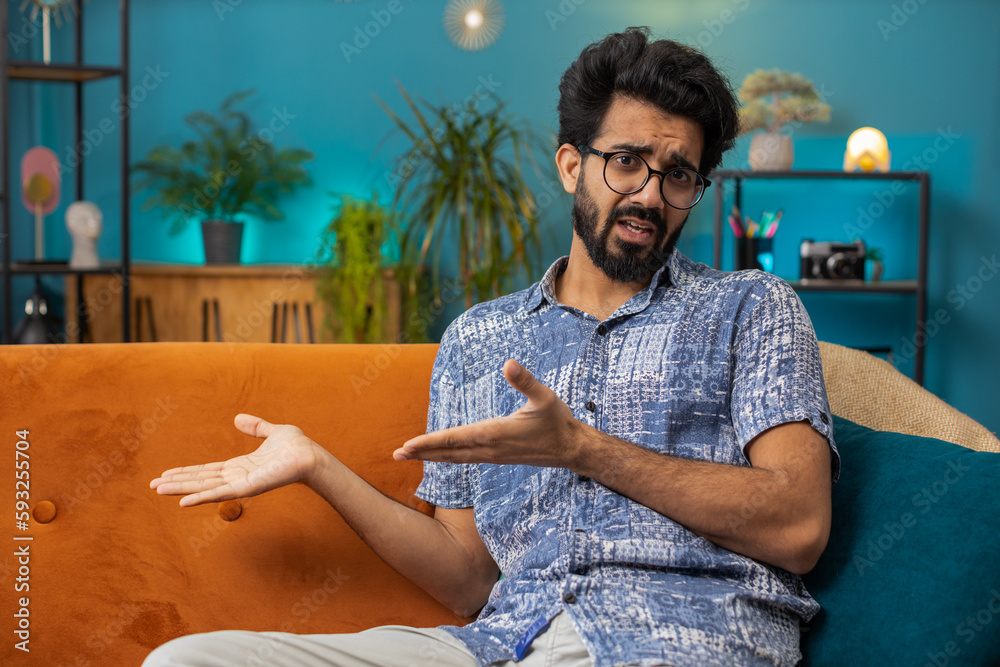 Indian man raising hands asking what why reason of failure, disbelief ...