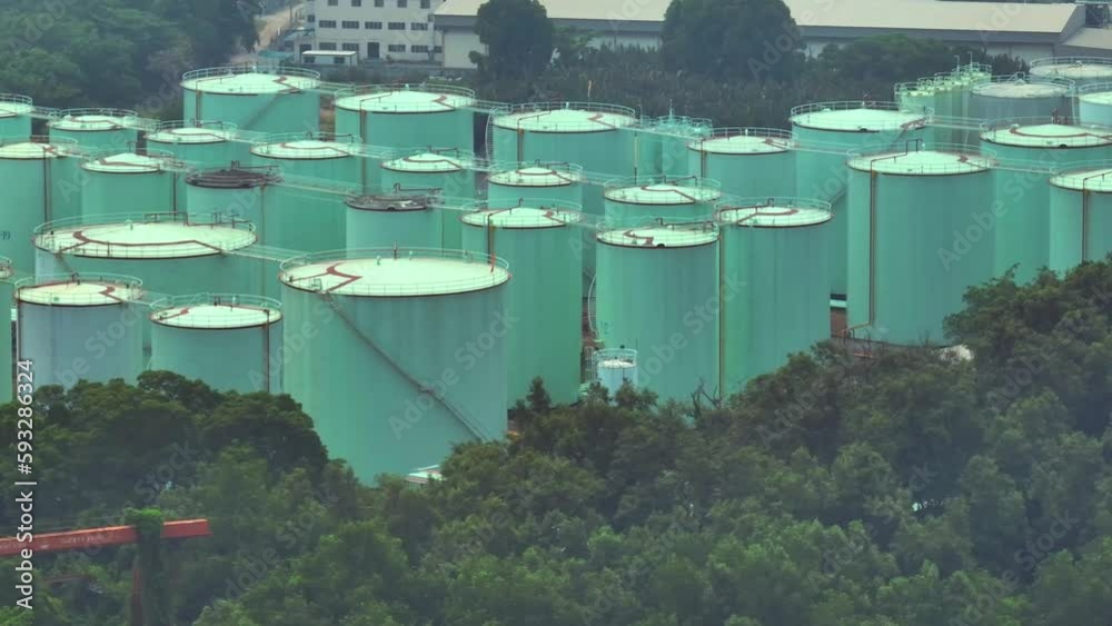 An oil depot typically appears as a complex of large storage tanks ...