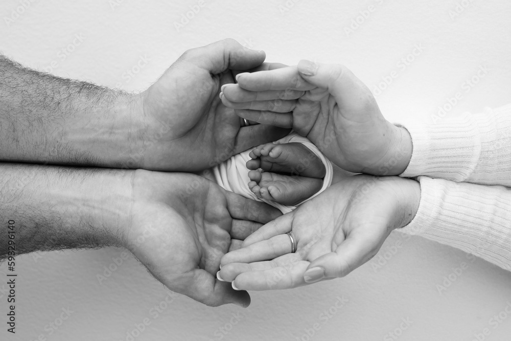 Children's leg in the hands of mother, father, parents. Feet of a tiny ... Children's leg in the hands of mother, father, parents. Feet of a tiny ...