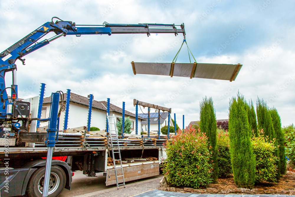 Truck Delivering Packages for a roof panels which will be using for ...