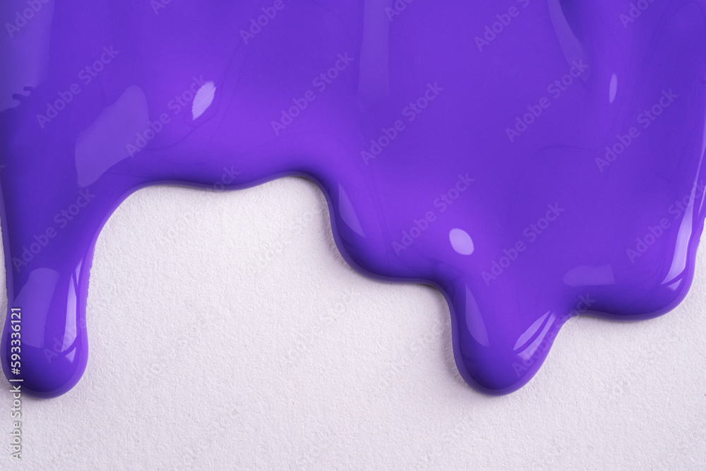 Violet liquid drops of paint color flow down on white canvas. Abstract ...