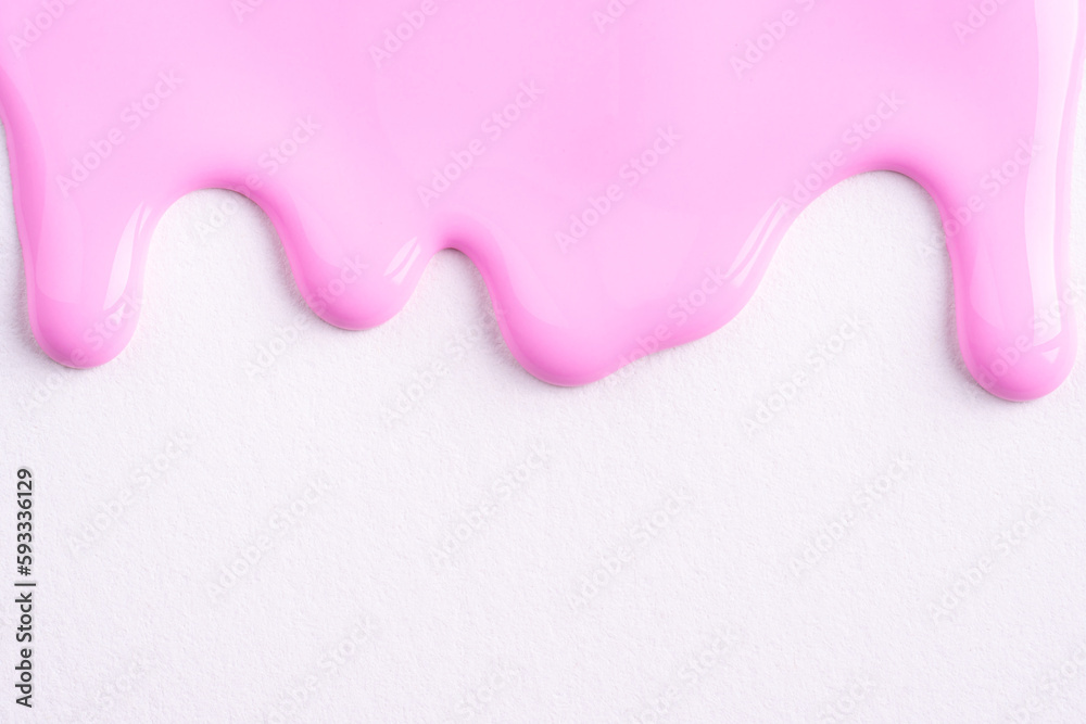 Pink liquid drops of paint color flow down on white canvas. Abstract ...