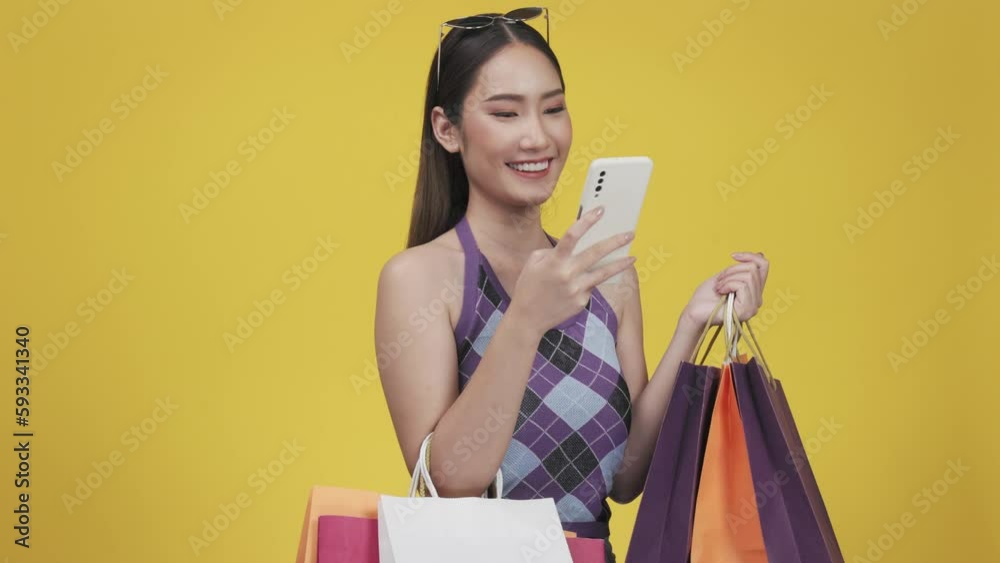 Asian young beautiful women are using smart phone shopping online with ...