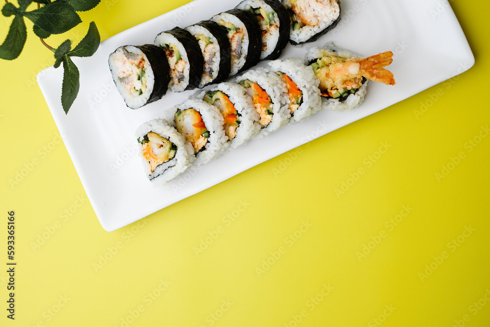 Top view of sushi roll made from Shrimp tempura and California roll on ...