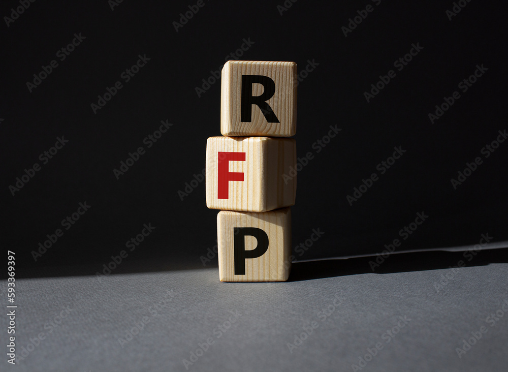 RFP - Request for Proposal. Wooden cubes with word RFP. Beautiful grey ...