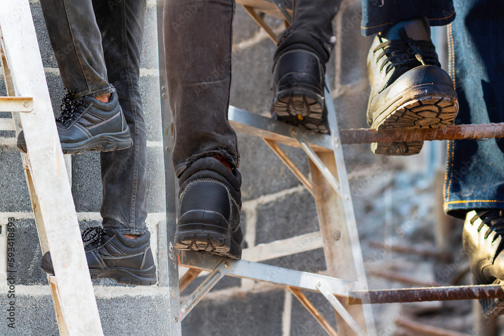 Foto de Wear safety shoes to ensure safety at work. construction ...