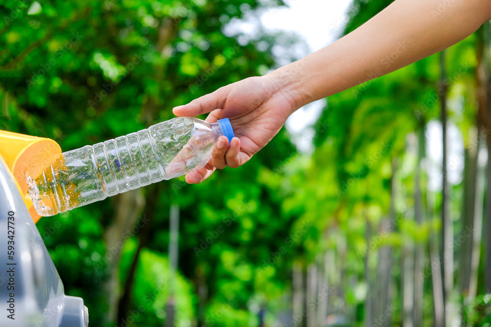 Please throw plastic bottles in the bin. Man littering the bins by ...