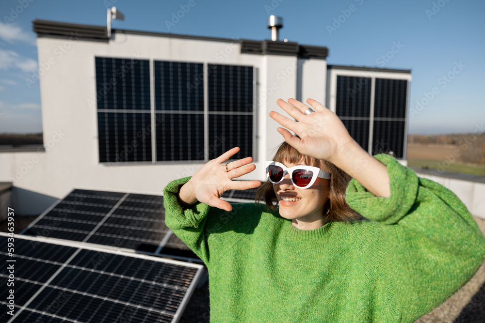 Foto de Woman plays with a sun, shading her face with hands, while ...