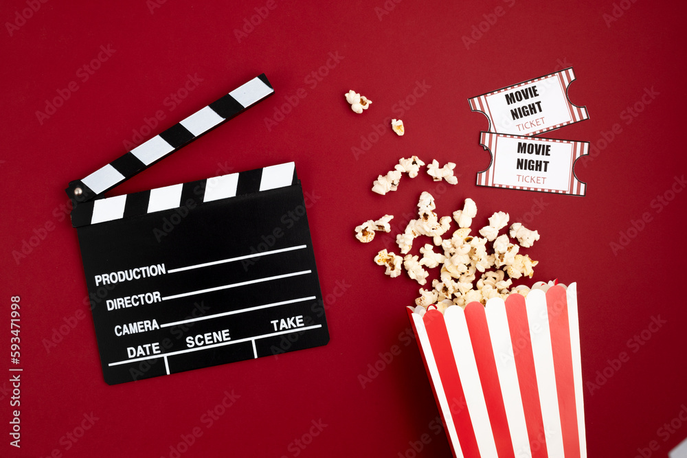 Movie clapperboard and cinema tickets. Home movie night, party ...