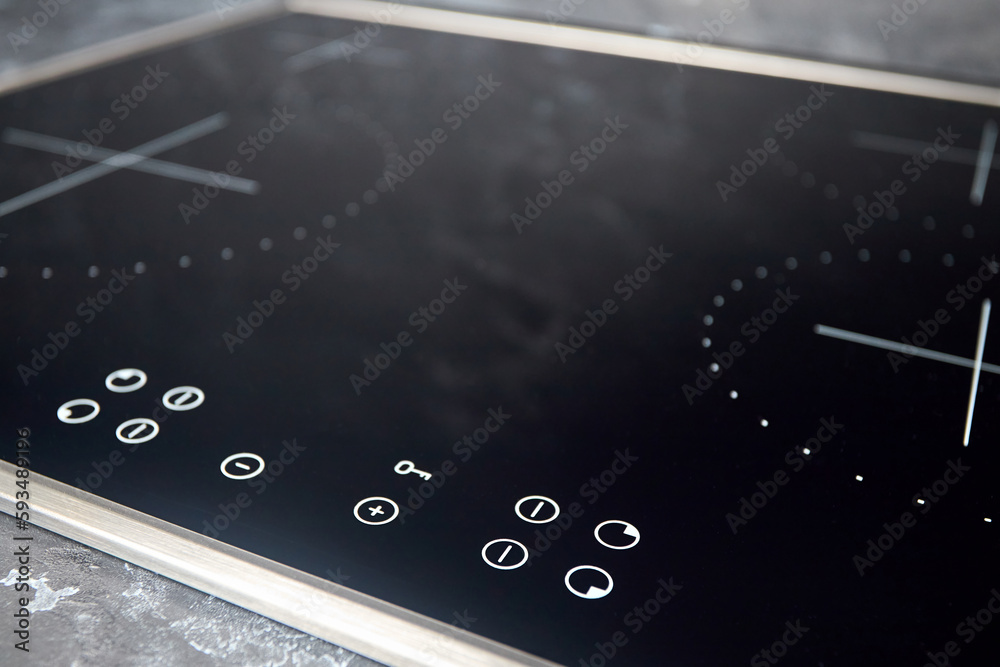 Foto de Modern induction electric hob cooker with control panel buttons ...